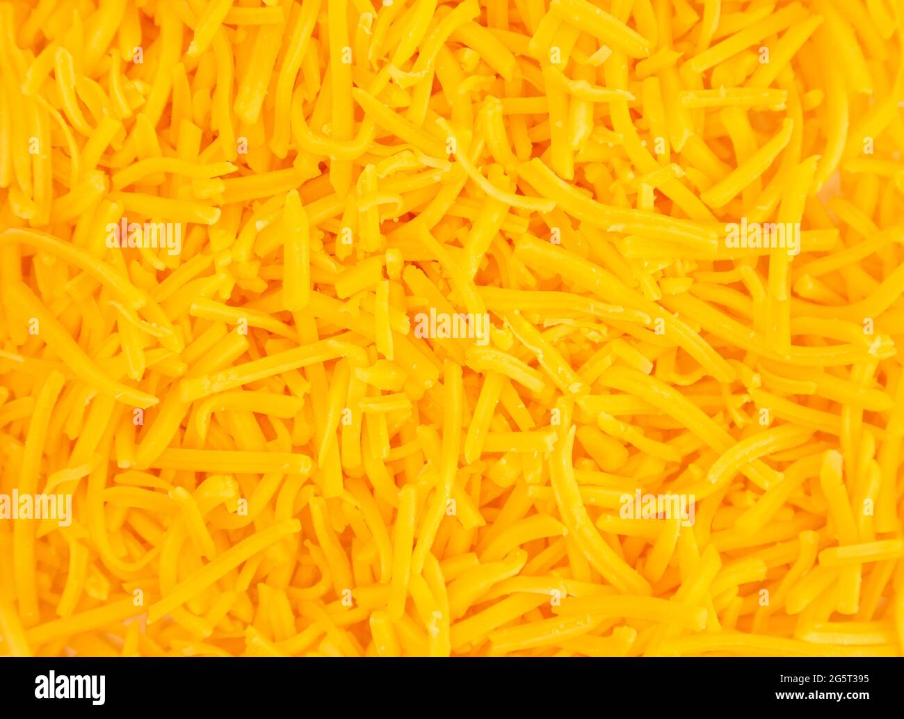A Background of Grated Orange Cheddar Cheese Stock Photo - Alamy