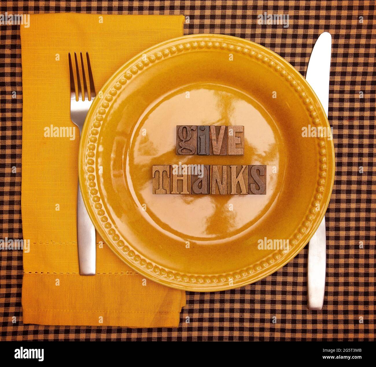 Give Thanks Spelled in Type Set on a Plate Setting for Thanksgiving ...