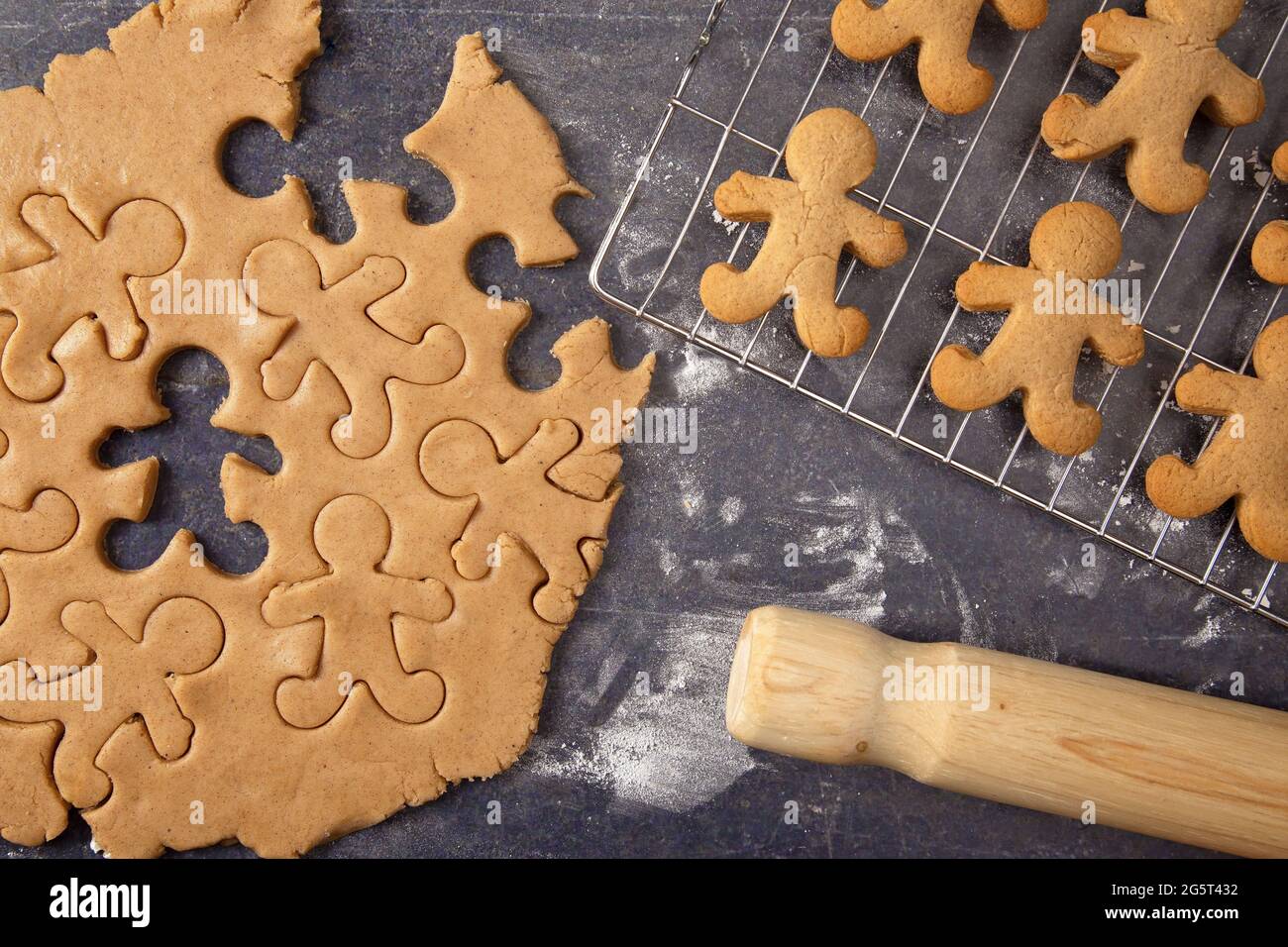 Gingerbread Cookie Dough Being Cut into People Shapes Stock Photo - Alamy