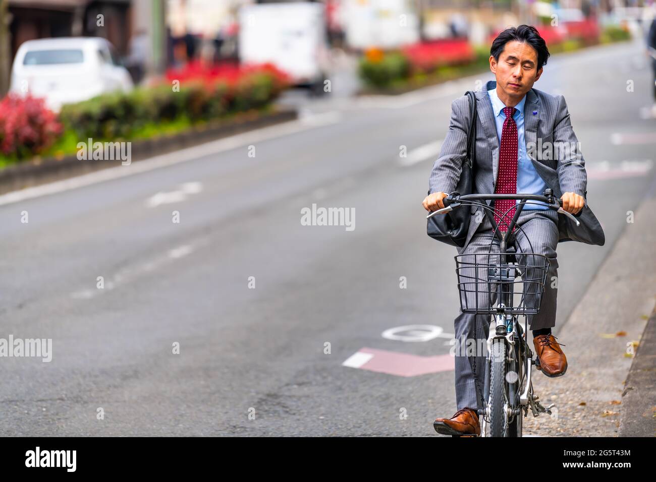 Kyoto, Japan - April 17, 2019: Japanese person on bicycle riding bike ...