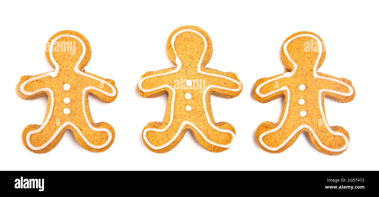 A Line of Three Decorated Gingerbread Men on a White Background Stock ...