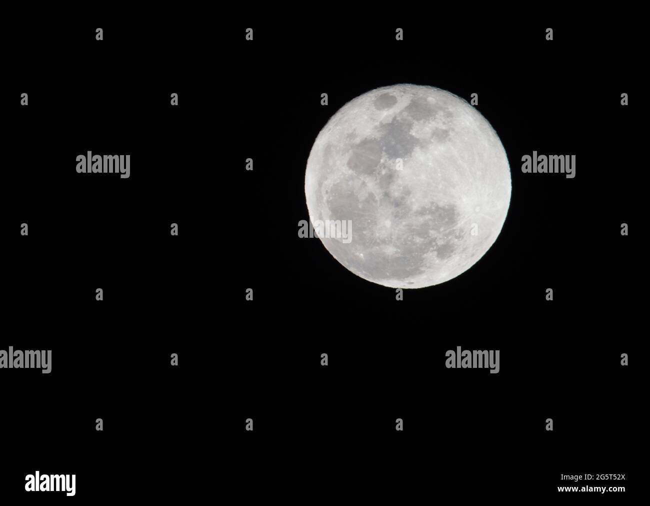 Closeup of bright full moon in Ecuador showing fine detail of lunar ...