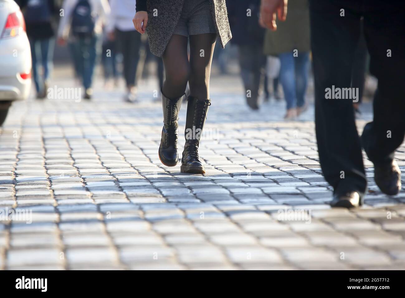 people crossing the road at a pedestrian crossing on the pavement Stock ...