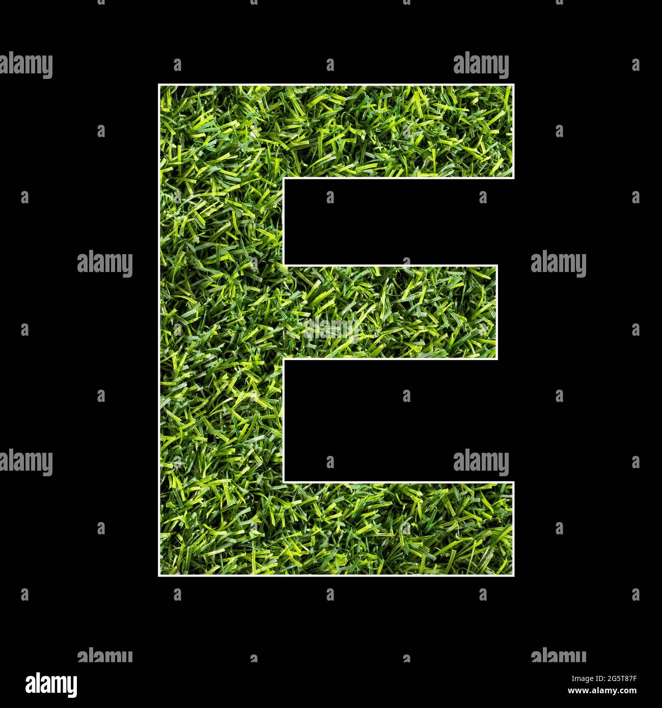 Letter E - Artificial grass background texture Stock Photo - Alamy