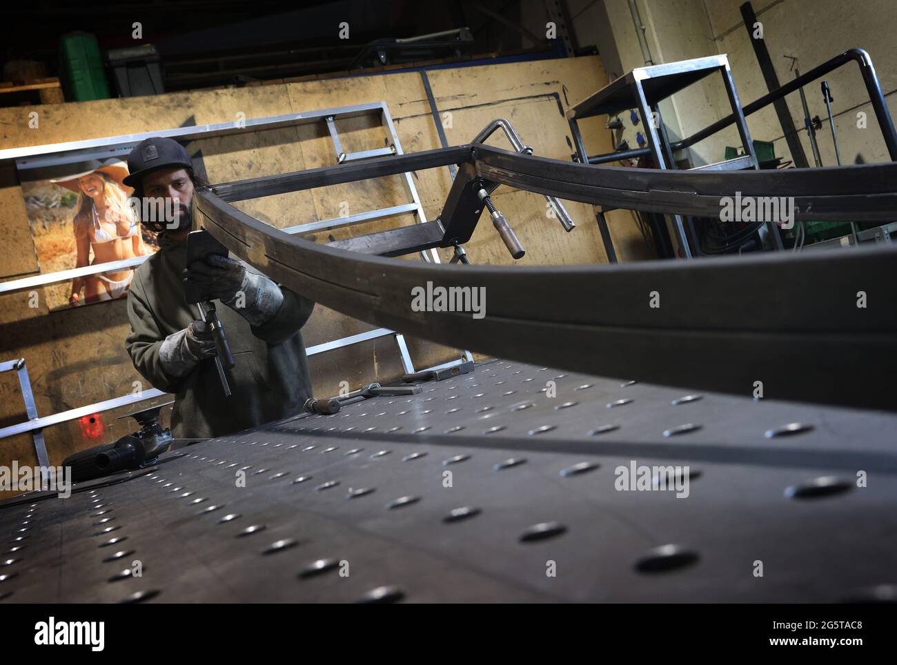 Durach, Germany. 06th May, 2021. An employee of the pumptrack ...