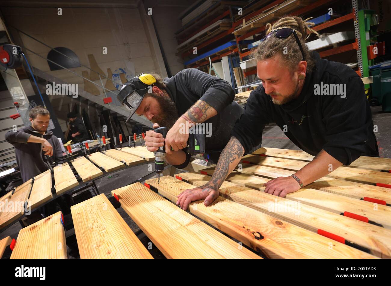 Durach, Germany. 06th May, 2021. Employees of the pumptrack ...