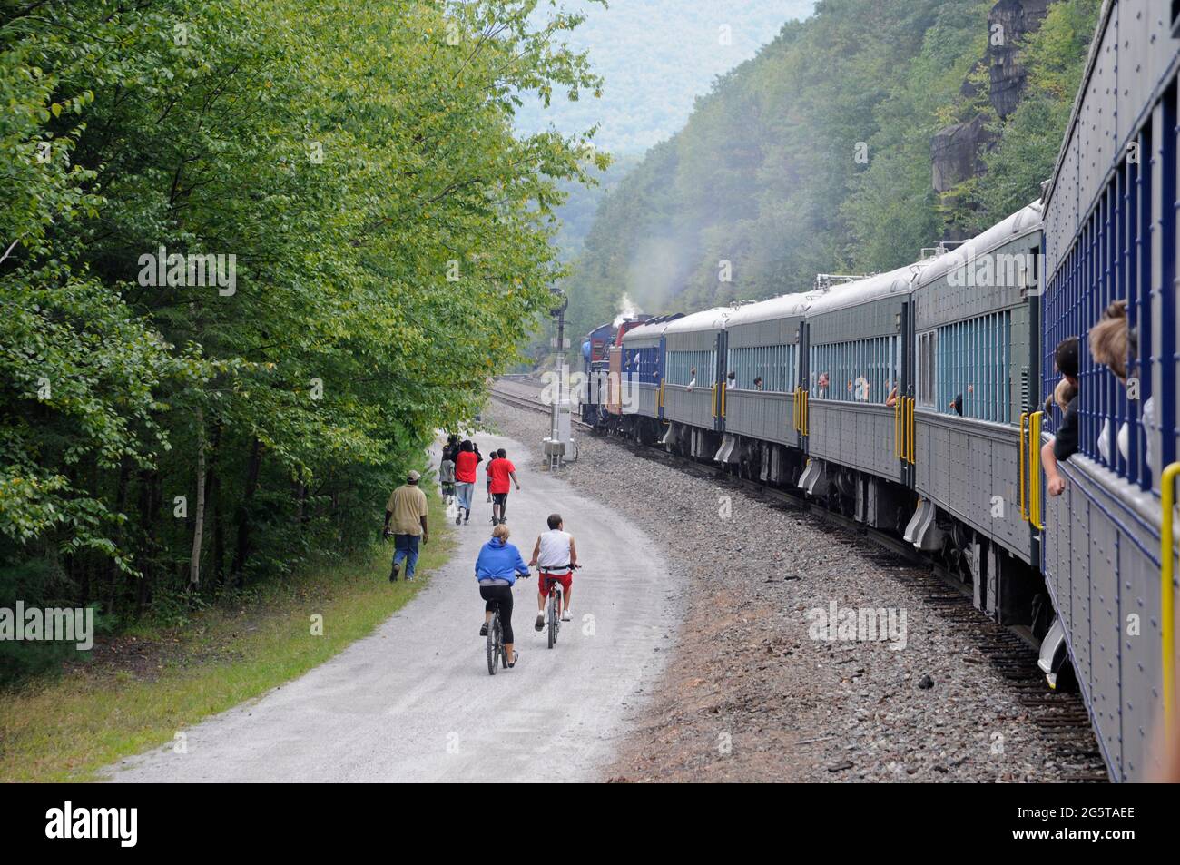 People from moving train watching on biking tourist, Lehigh Gorge ...