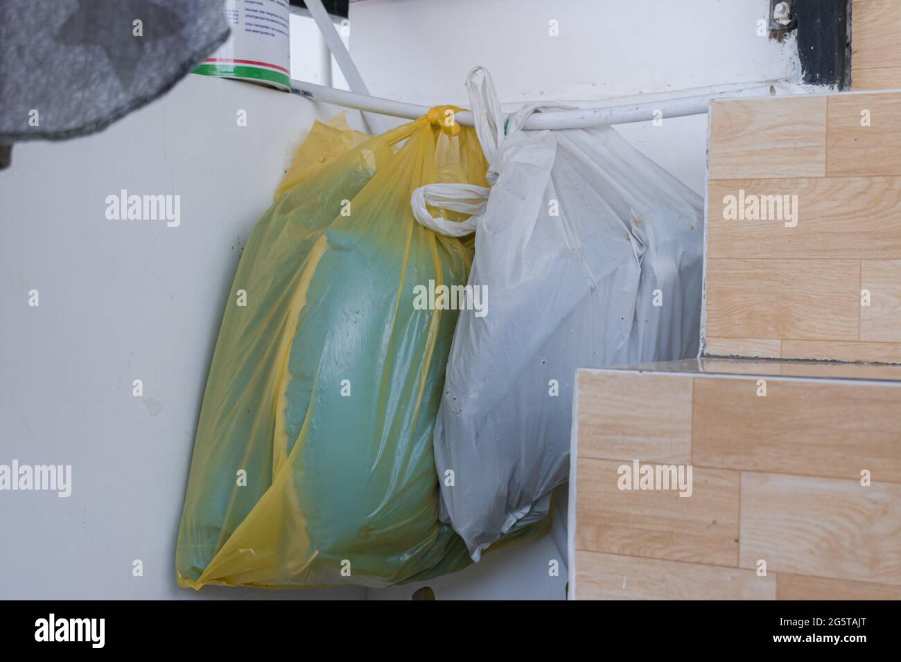 yellow and white plastic. The plastic is used to wrap some objects and ...