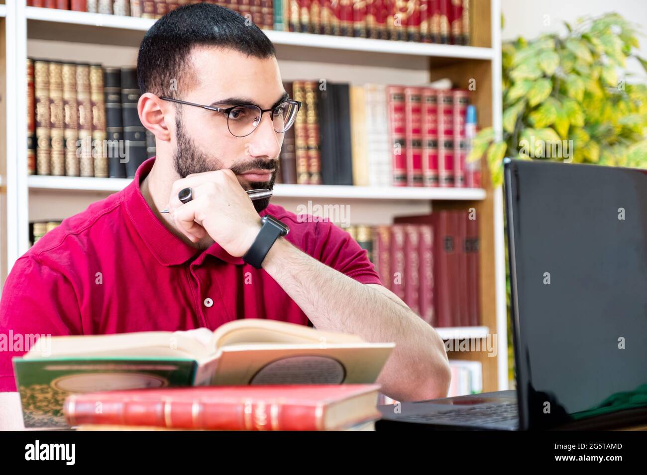 Arabic man using a laptop during conferences or meetings for studying ...