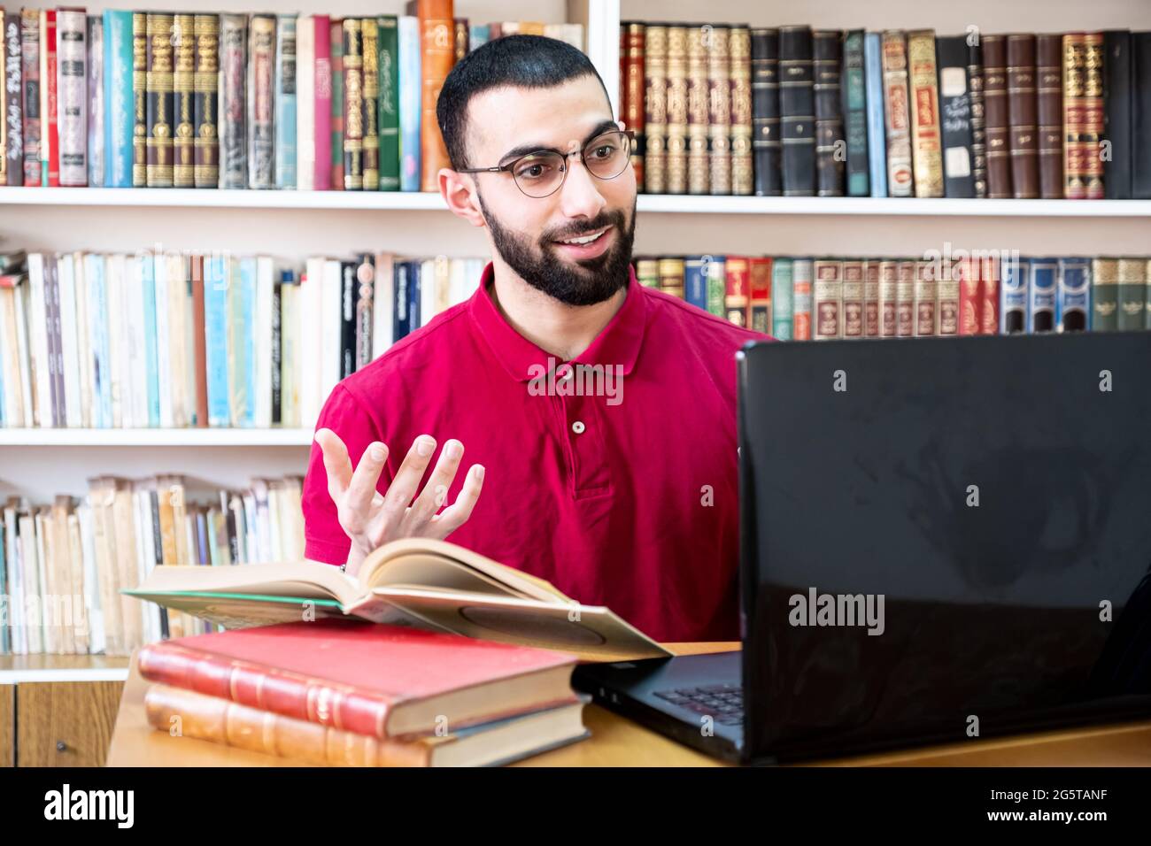 Arabic man using a laptop during conferences or meetings for studying ...