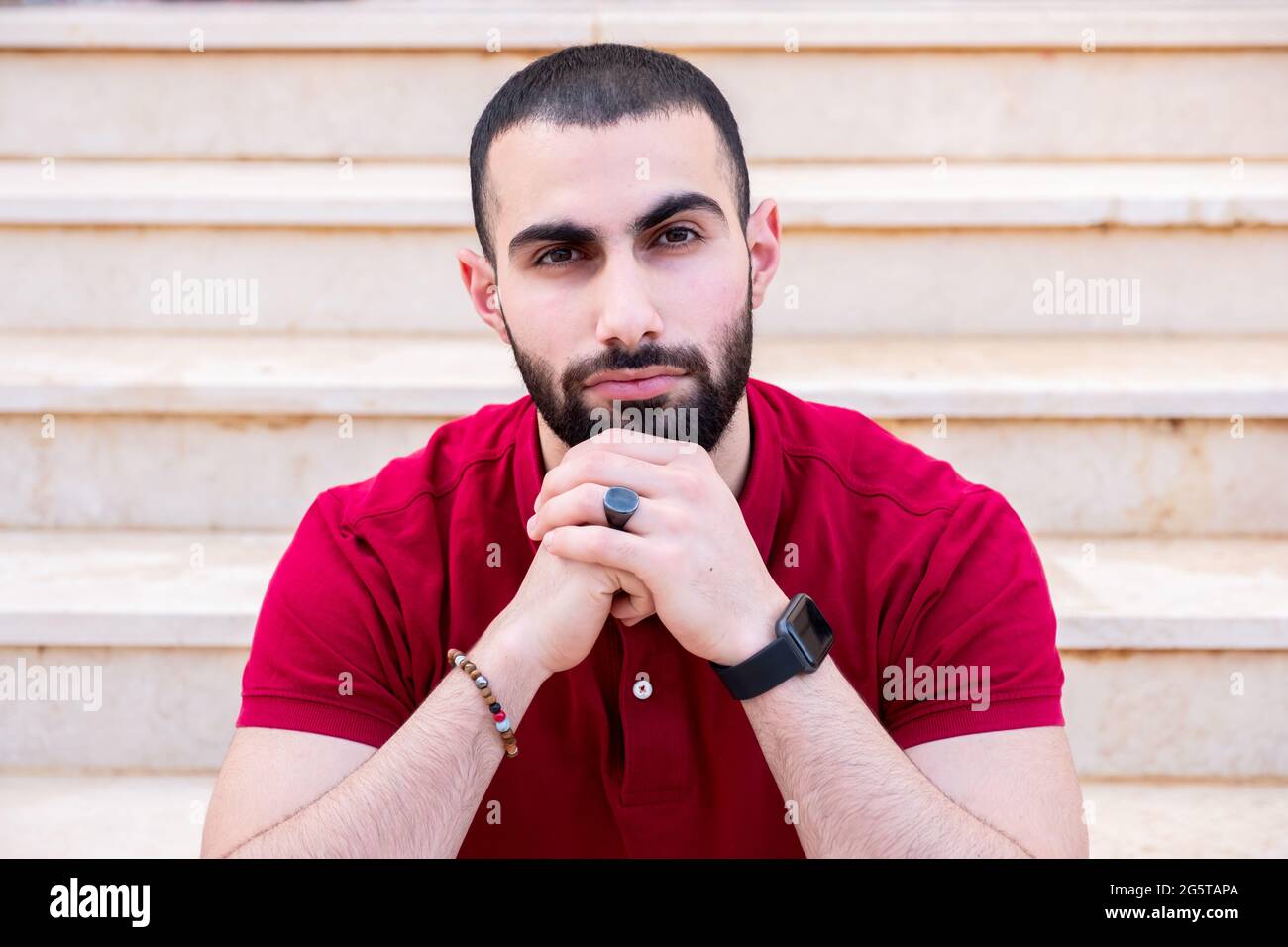 Man sitting on stairs and thinking Stock Photo - Alamy
