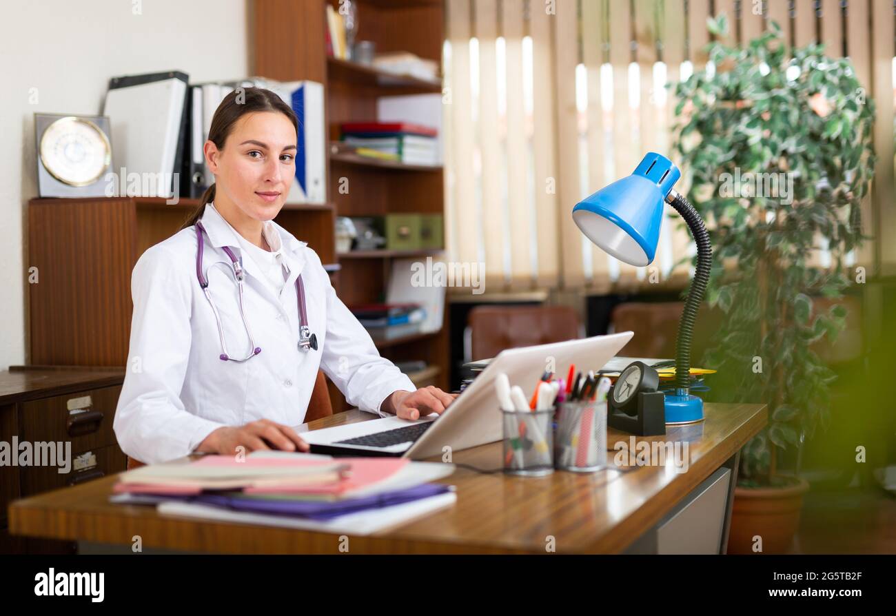 Portrait of a young female therapist working in the office at a ...