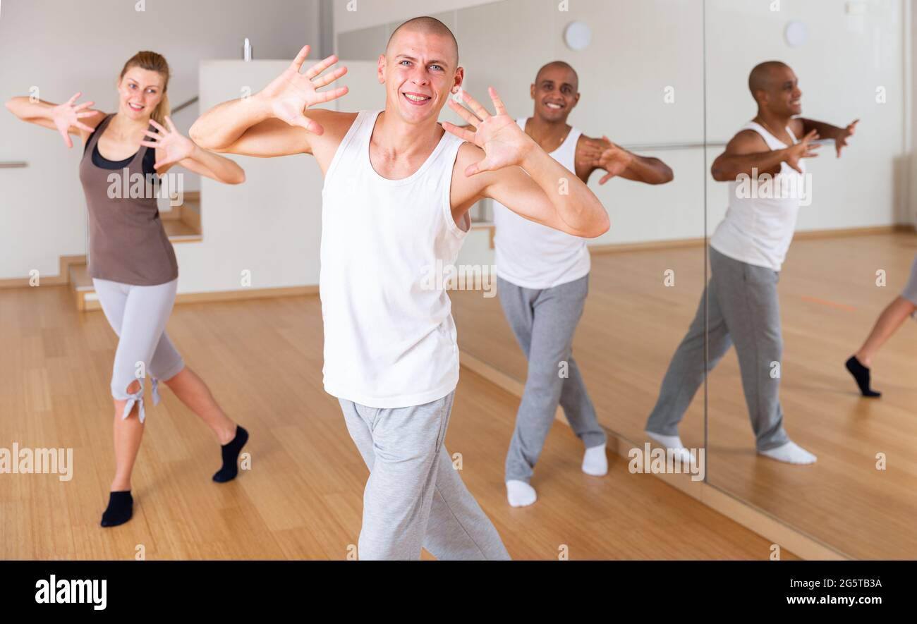 Man dancing at group lesson in studio Stock Photo - Alamy