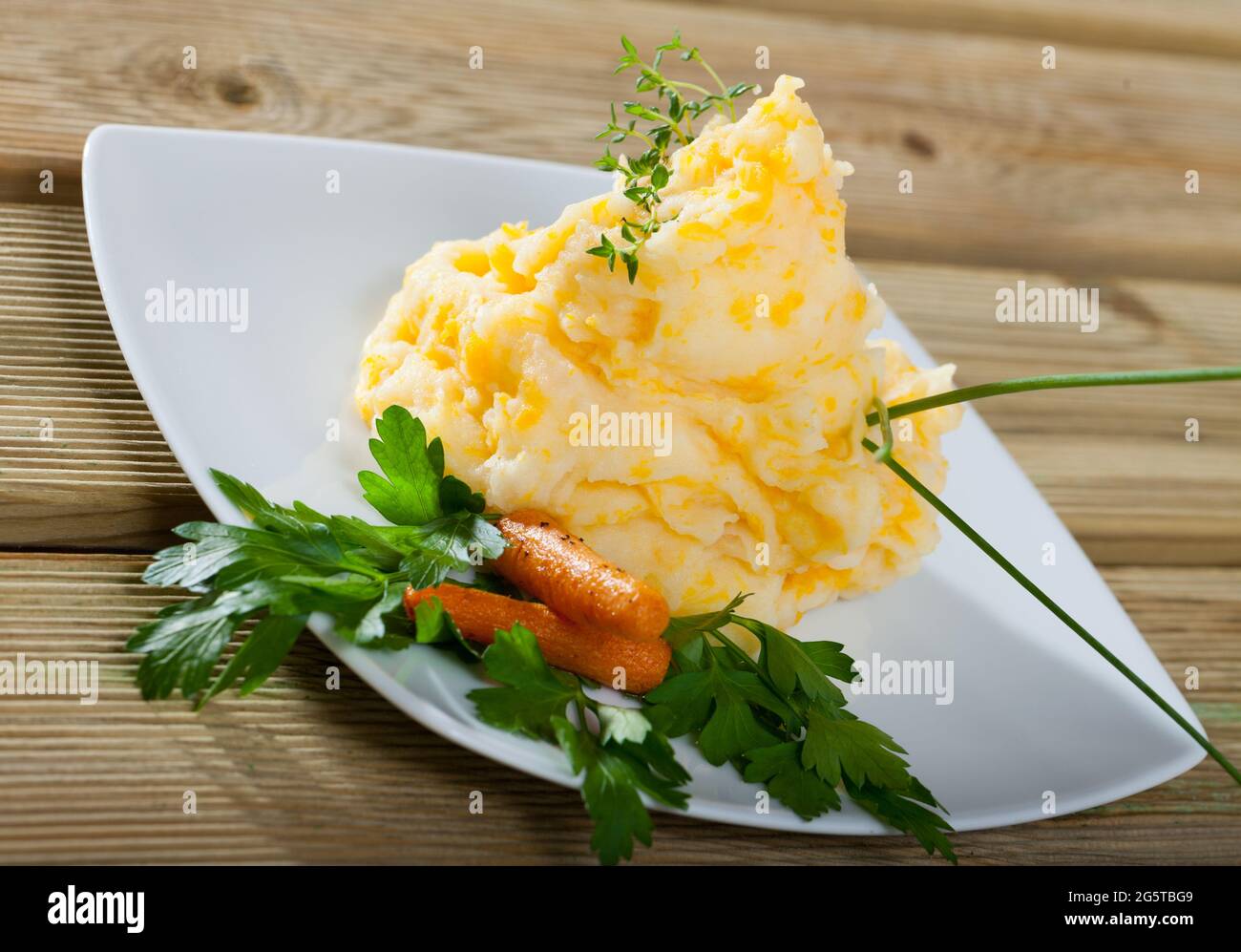 Mashed potato with carrots and herbs Stock Photo - Alamy