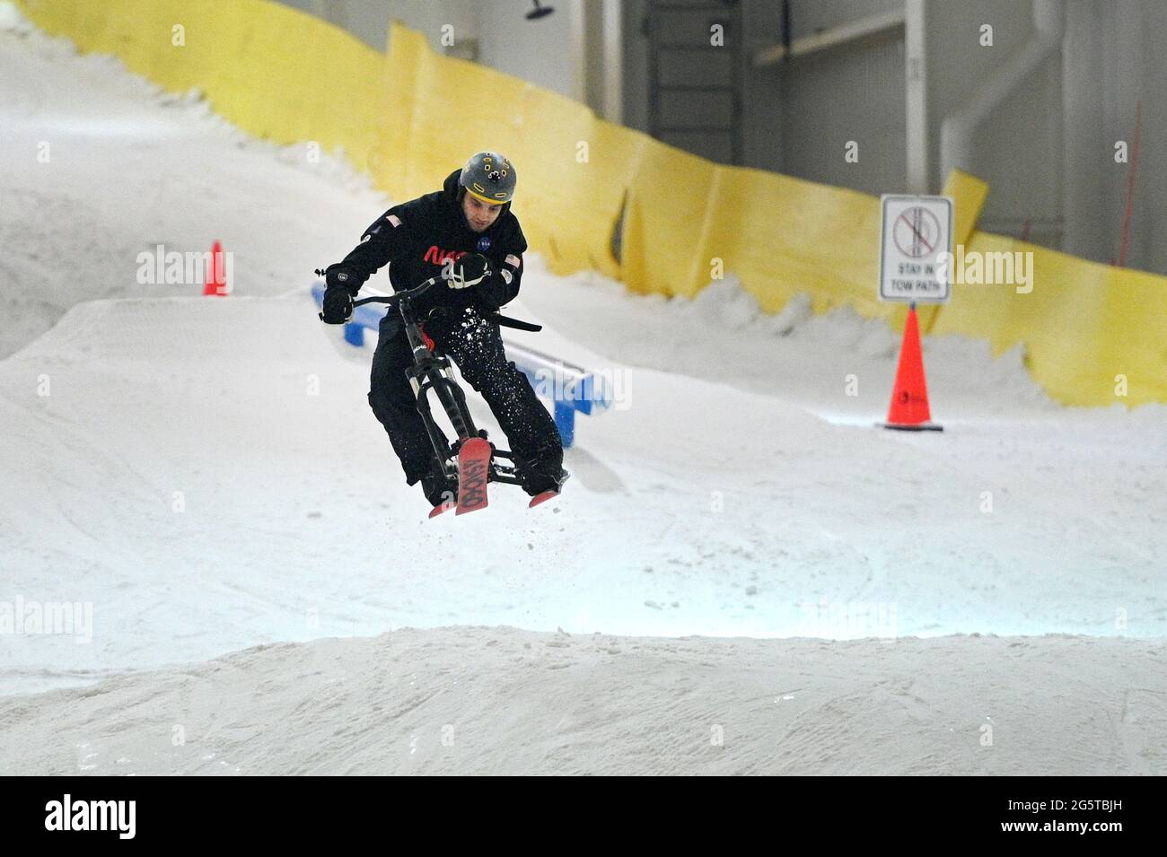 East Rutherford, USA. 29th June, 2021. A skier a trick with a snow-bike ...