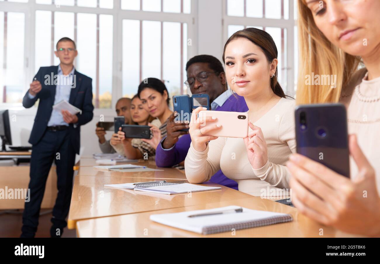 Students filming with smartphone hi-res stock photography and images ...