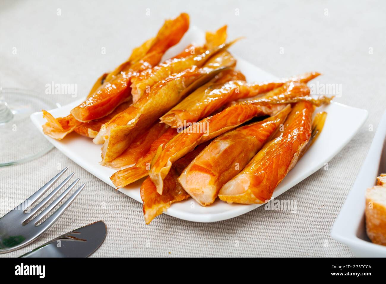 Smoked salmon belly flaps on plate Stock Photo - Alamy