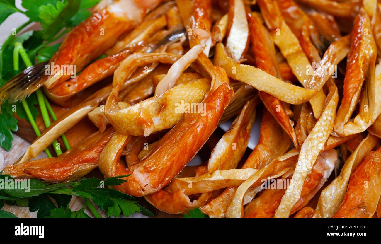 Cold smoked salmon belly strips Stock Photo - Alamy