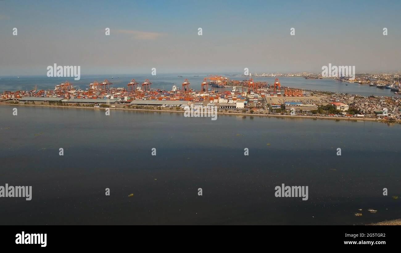Aerial view industrial cargo port with ships and cranes, Manila. View ...