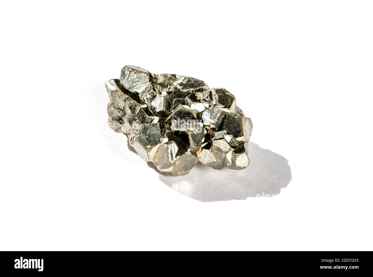 Pyrite gemstone isolated on a white background Stock Photo - Alamy