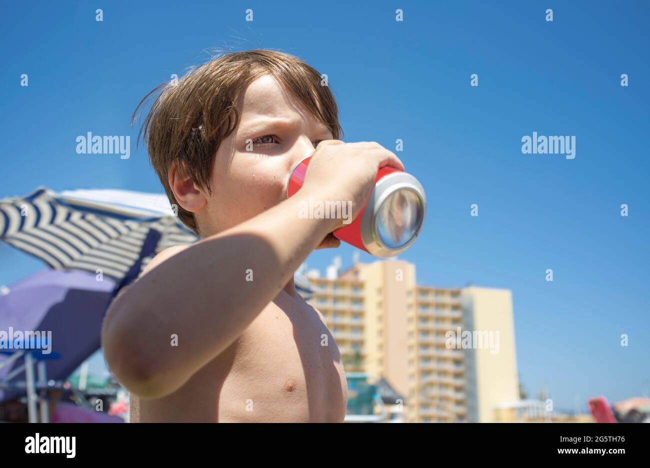 Boy drinking cola can hi-res stock photography and images - Alamy