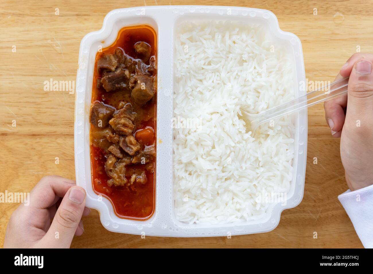 kid about to eat a fresh self cooking fast food of rice with beef Stock ...