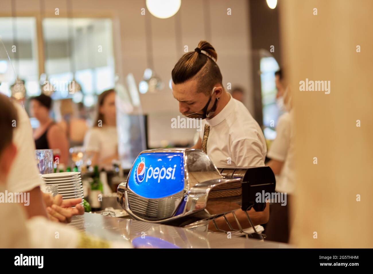 Kemer, Turkey - May, 25: Serving alcoholic drinks at the bar. Queue to ...
