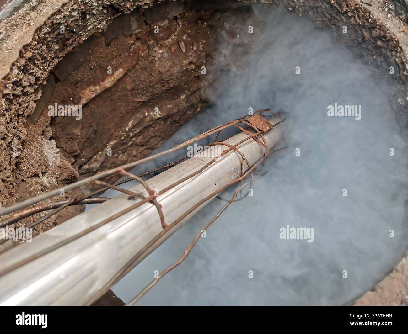 spraying disinfectant to the sewer Stock Photo - Alamy