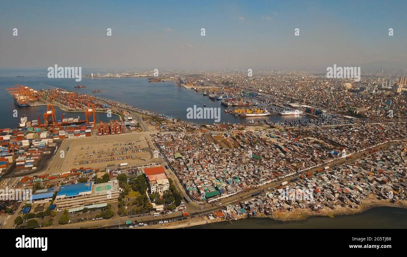 Aerial view industrial cargo port with ships and cranes, Manila. View ...