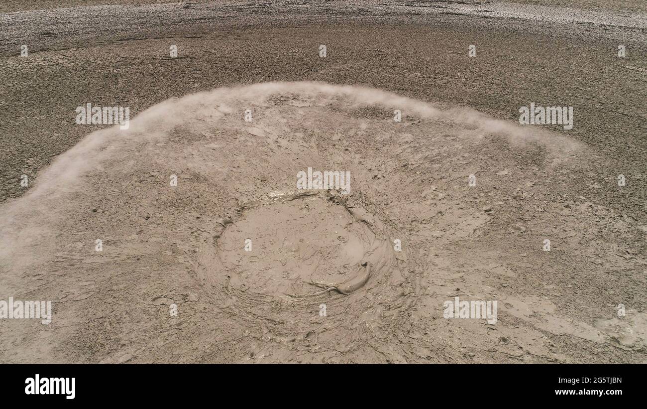 Mud volcano with bursting bubble bledug kuwu. aerial view volcanic ...