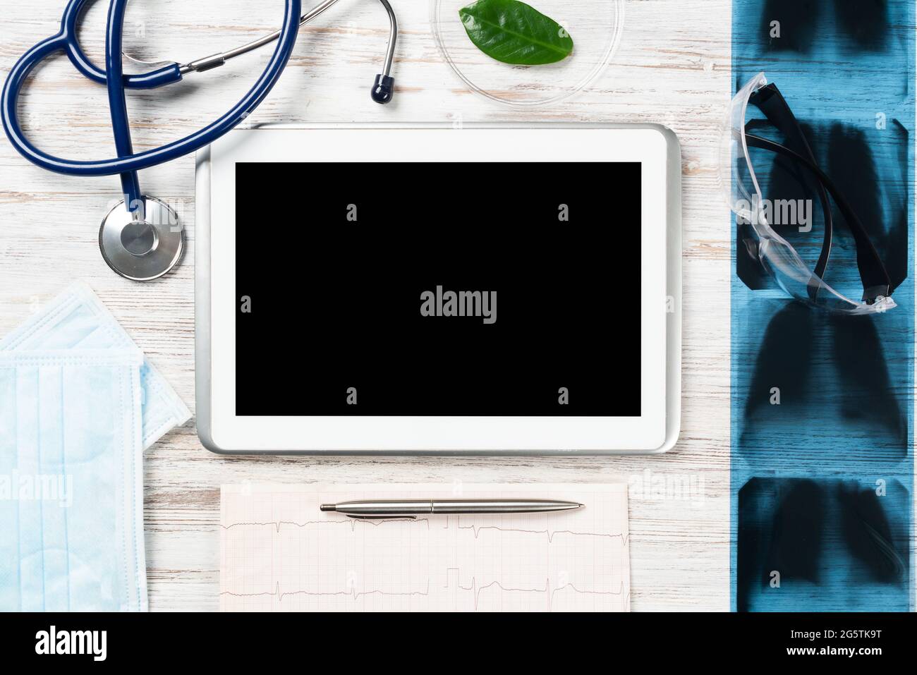 Mock up of doctors desktop with medical supplies Stock Photo - Alamy