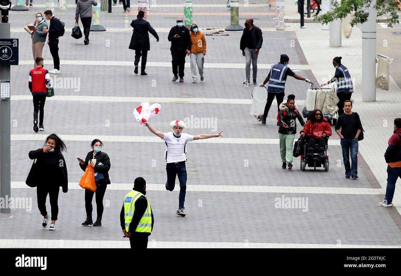 London, UK. 29th June, 2021. An England fan runs down Wembley Way ...
