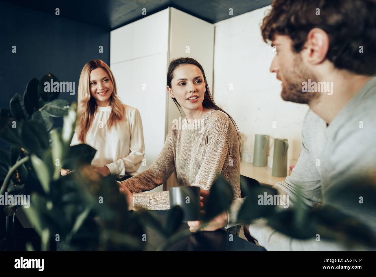 Young businesspeople colleagues having a coffee break in office ...
