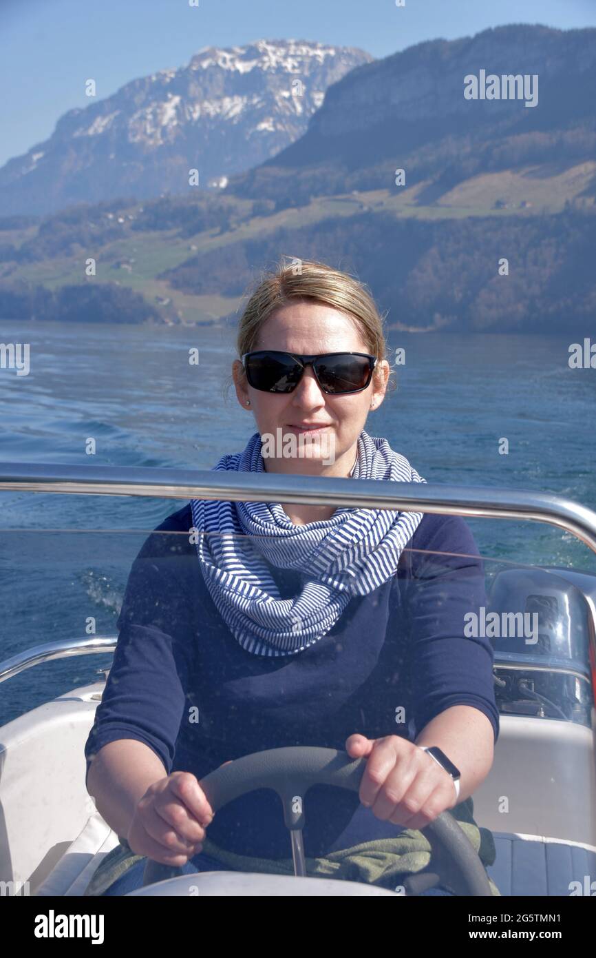 Woman driving speedboat on lake hi-res stock photography and images - Alamy
