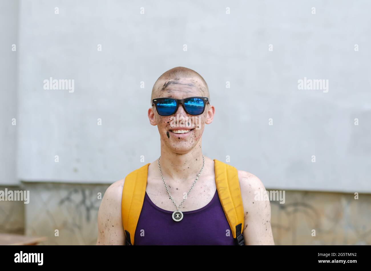 Portrait of a mechanic with sunglasses. Very Satisfied young adult with ...