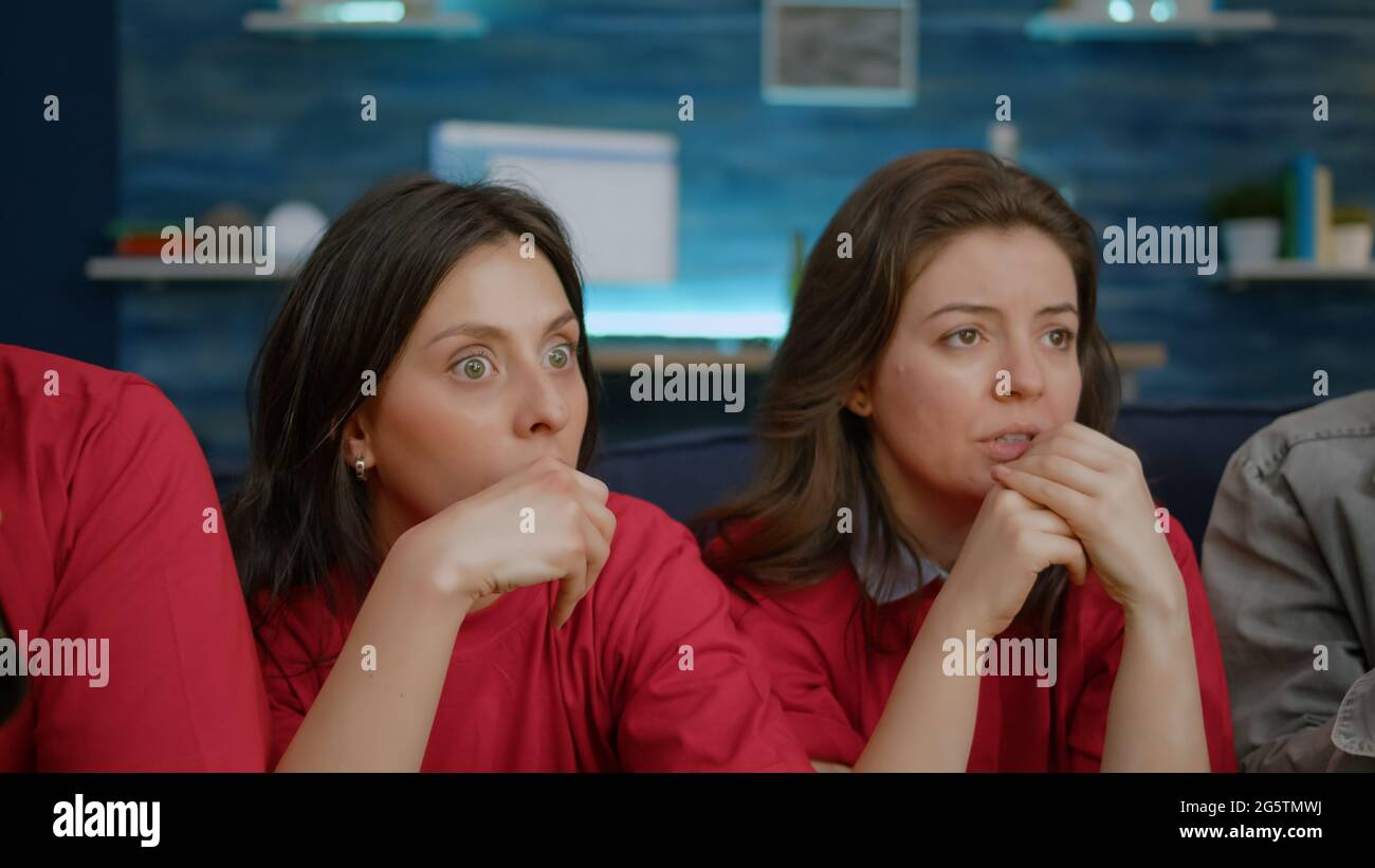 Multiethnic friends hanging out together watching football match ...