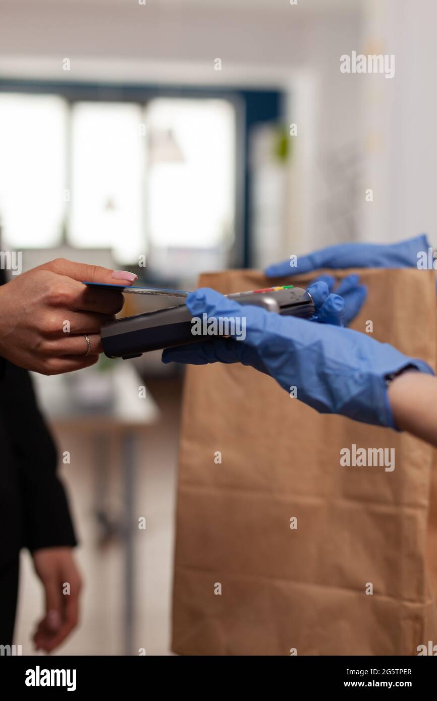 Woman paying takeaway meal hi-res stock photography and images - Alamy
