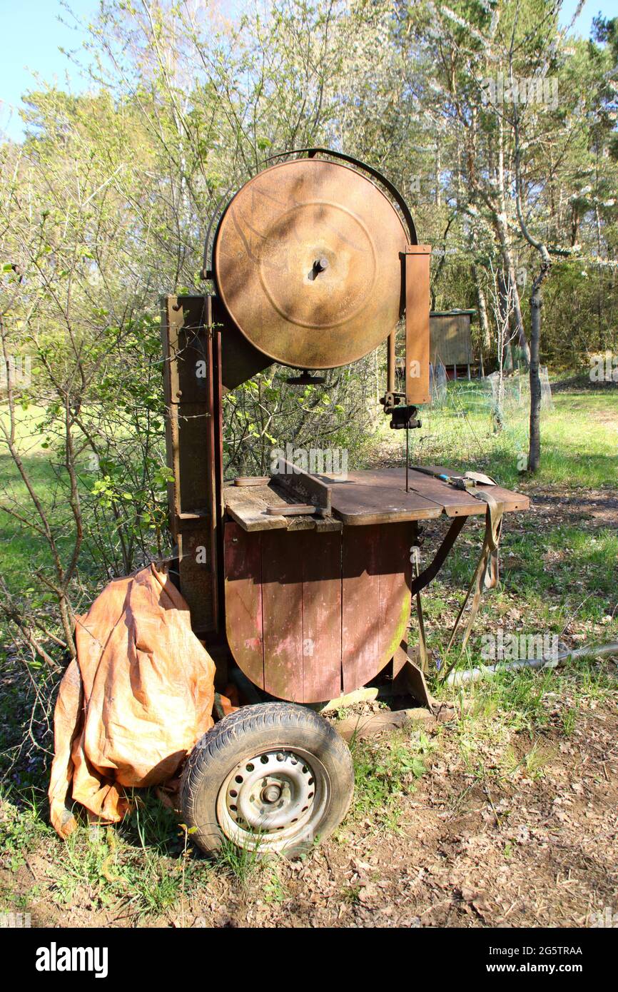 Old rusted band saw with wheels Stock Photo - Alamy