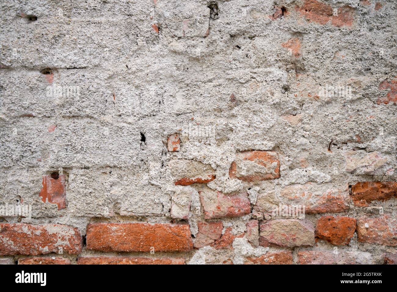 Moldy stone wall through damp walls structure photographed in daylight ...
