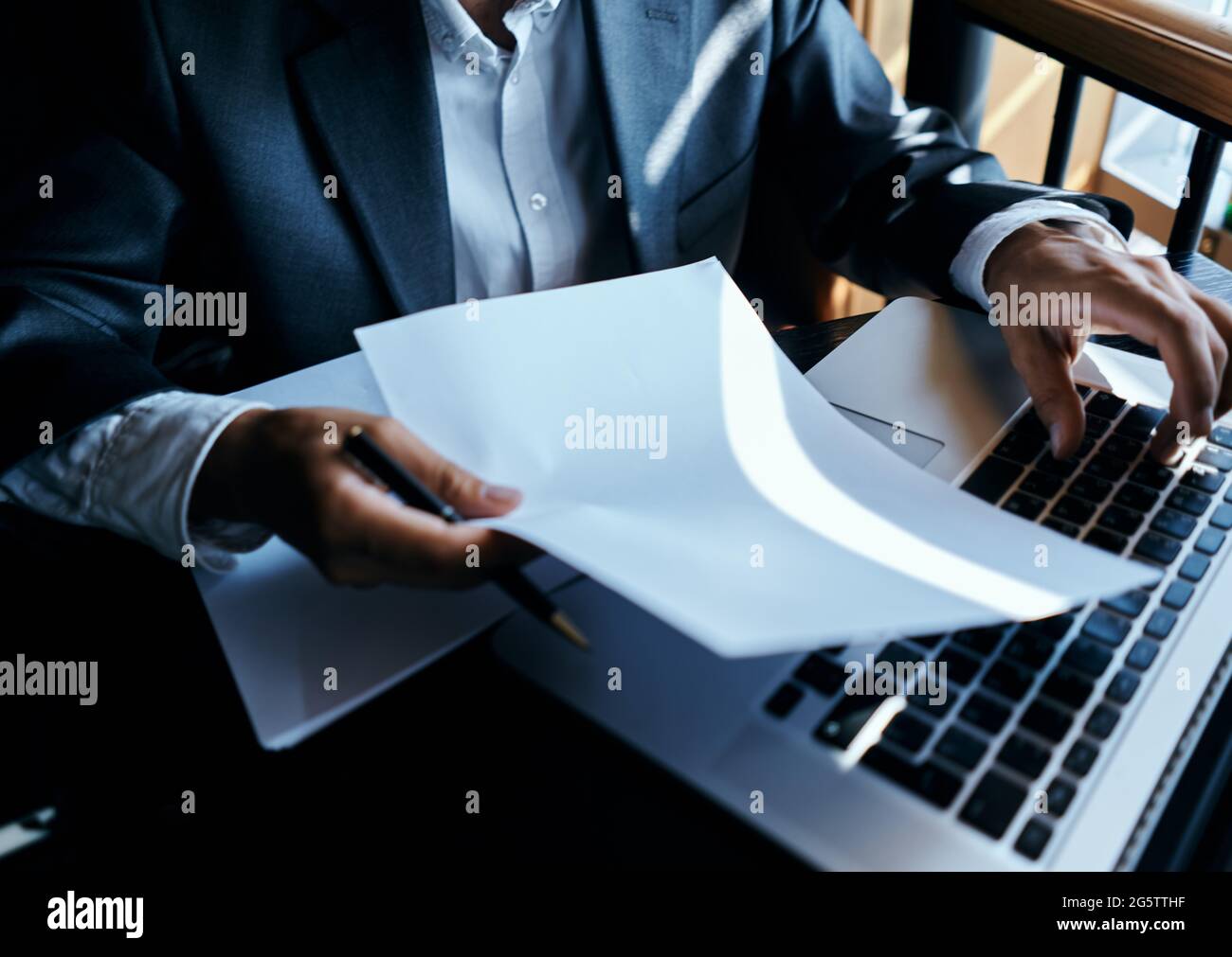 business man sitting at a table in a cafe paper laptop work Stock Photo ...
