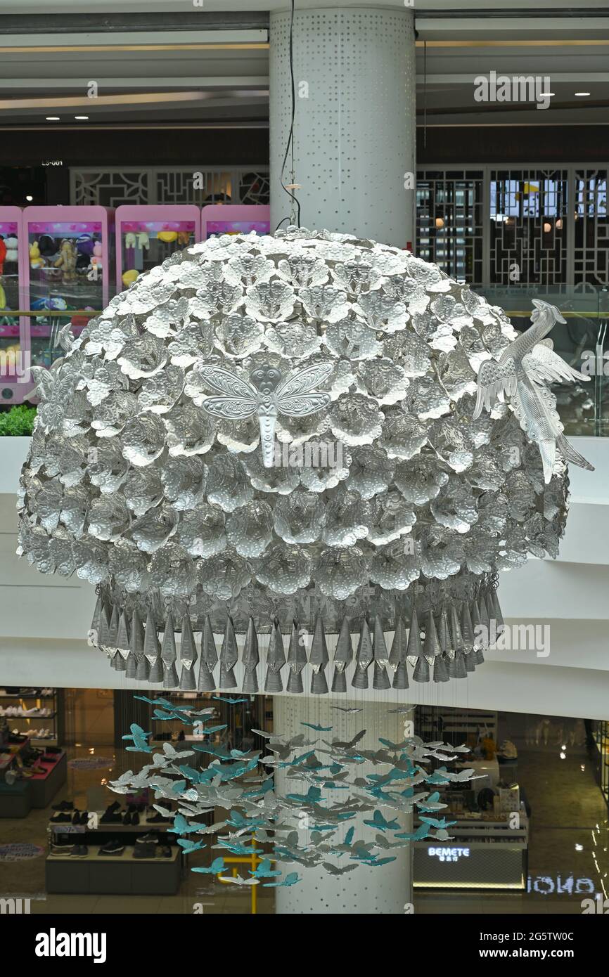 GUIYANG, CHINA - JUNE 17, 2021 - A giant silver hat worn by a Miao ...