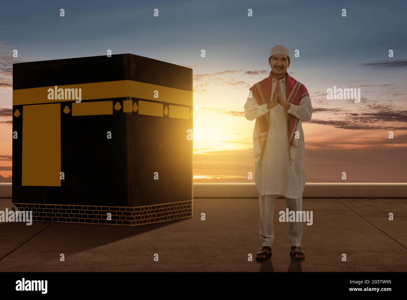 Asian Muslim man standing with greetings gesture with Kaaba background ...