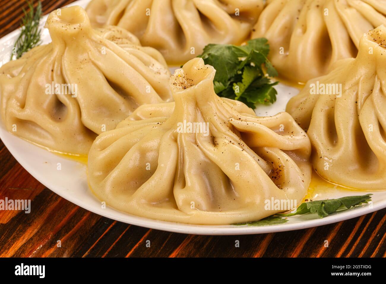 Georgian traditional cuisine – juicy Khinkali with meat Stock Photo - Alamy