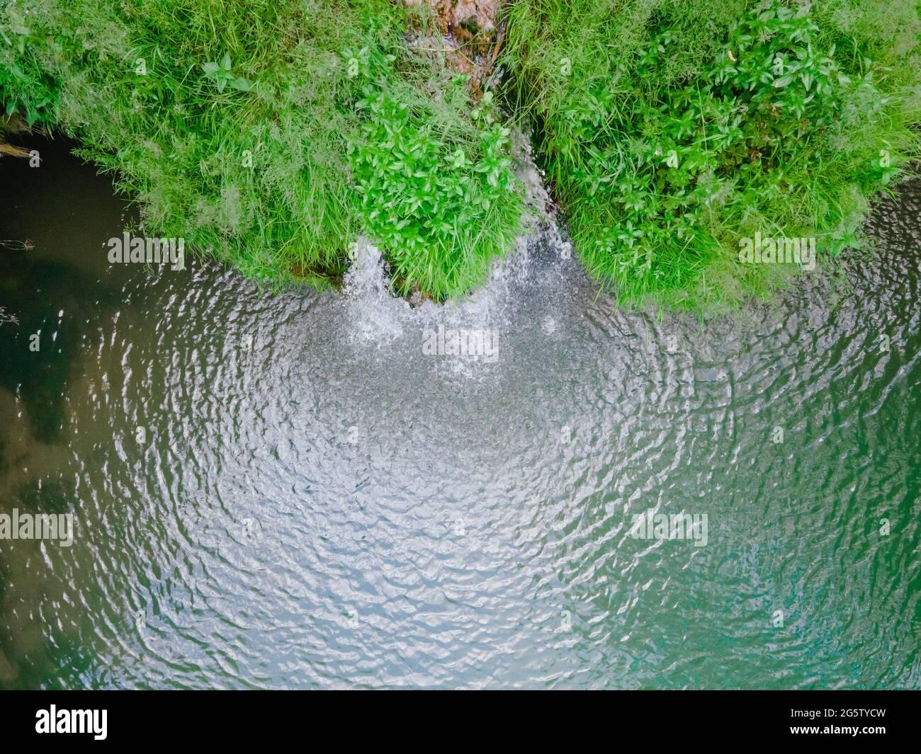 aerial view of beautiful waterfall with blue lake copy space Stock ...