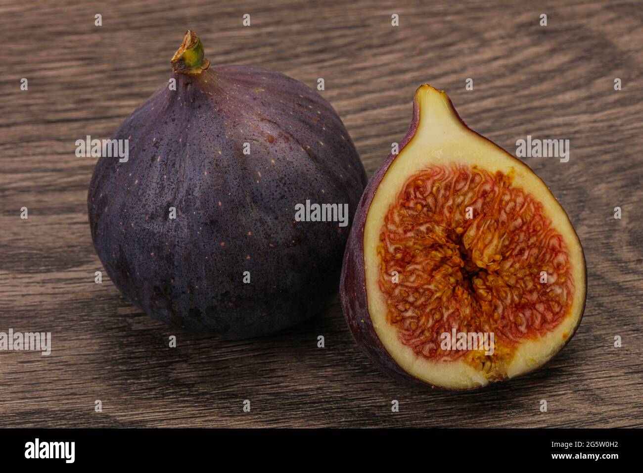 Sweet purple slice of fig fruit Stock Photo - Alamy