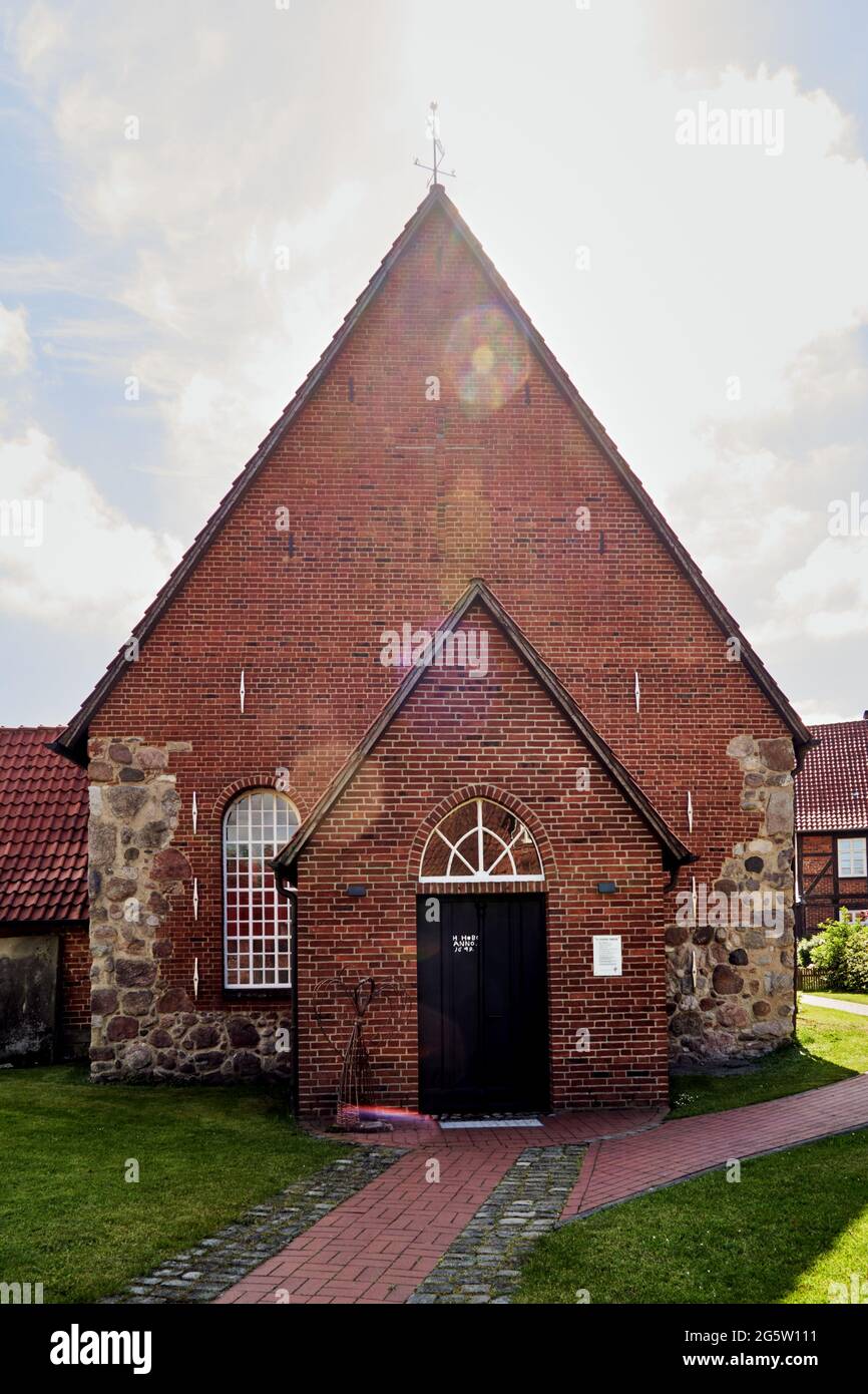 Red brick church with small porch in a village in Lower Saxony, Germany ...