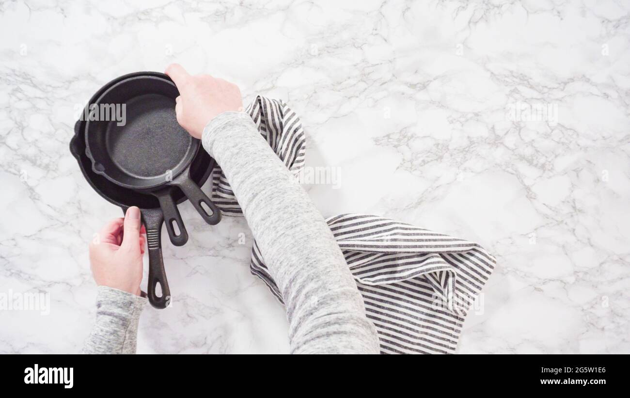 Flat lay. Variety of cast iron kitchenware on a marble countertop Stock ...