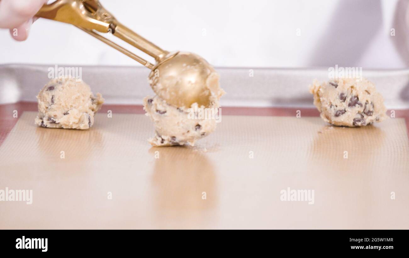 Step by step. Scooping homemade chocolate chip cookies with metal dough ...