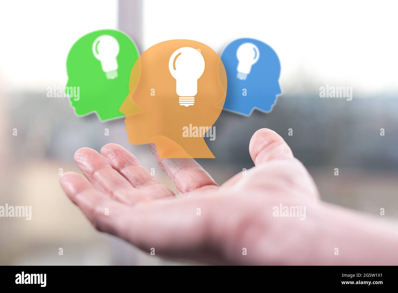 Human brain ideas concept above a hand of a man Stock Photo - Alamy
