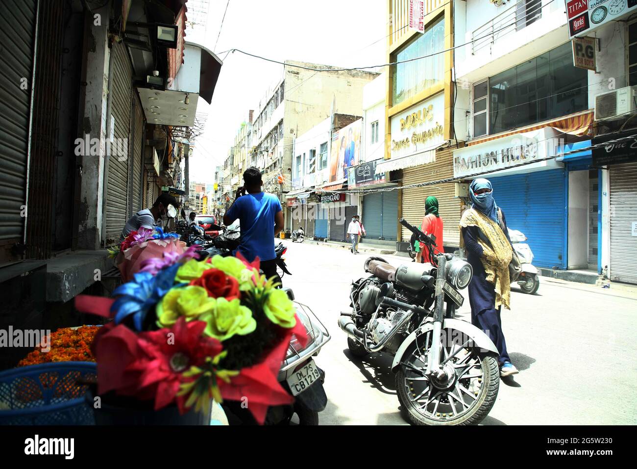 Delhi, India. 29th June, 2021. Shopkeeper and DCD Staff sitting the ...